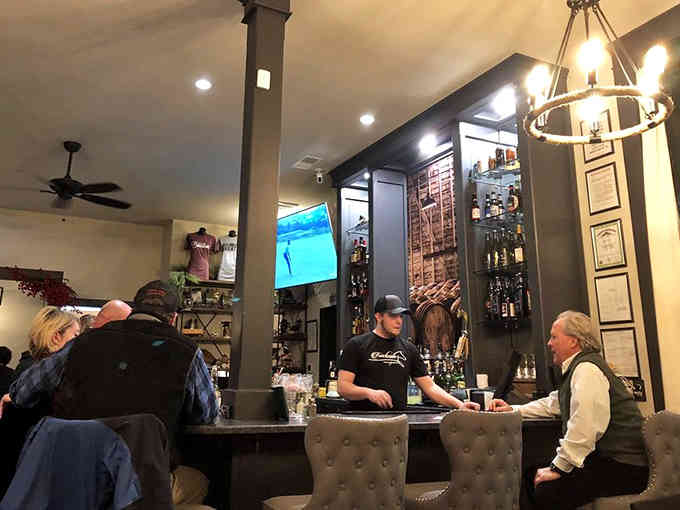 The bar buzzes with friendly conversation while bourbon bottles stand ready to pour Kentucky's finest into your waiting glass.