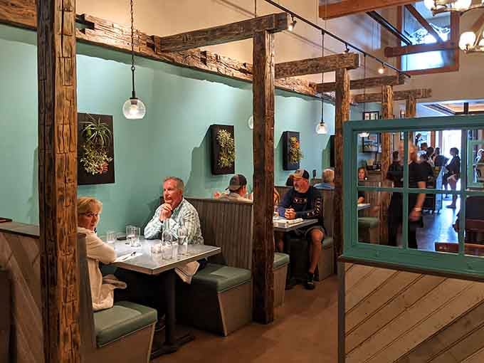 Local diners enjoying their meals in comfortable booths, because good food brings the community together every single time.