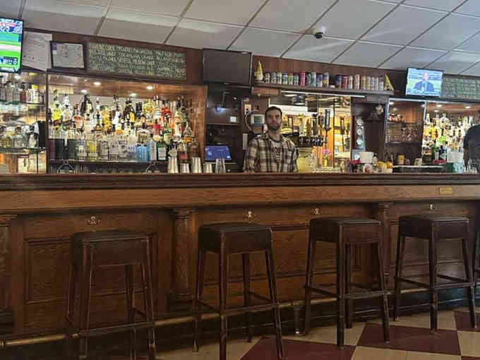 Behind this polished bar, bartenders have mixed drinks and heard stories since Prohibition's end changed everything.