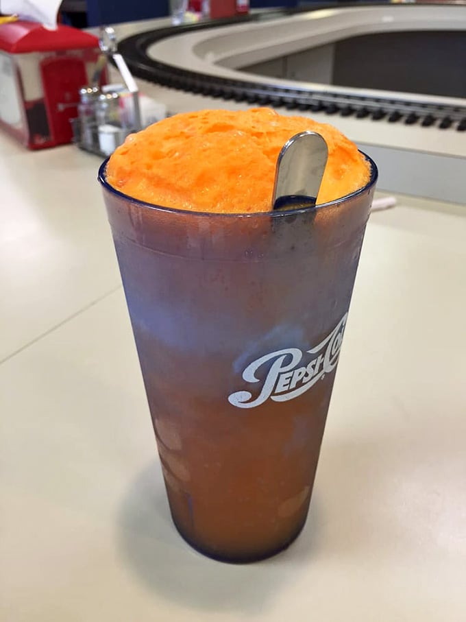 The orange float bubbles with nostalgic charm, a fizzy reminder of simpler, sweeter times gone by.