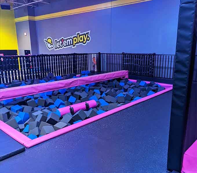The foam pit awaits your graceful dive or, more likely, your spectacular belly flop into cushioned glory.