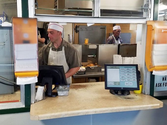 Watch the grill masters at work, flipping patties with the precision of surgeons and the passion of artists.