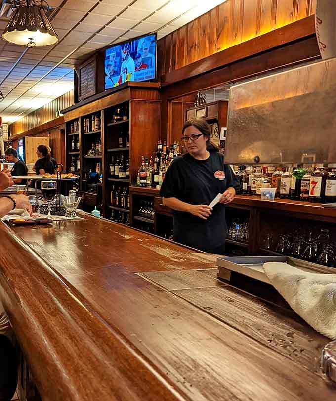 The bar area maintains that classic neighborhood restaurant vibe where everybody feels welcome.