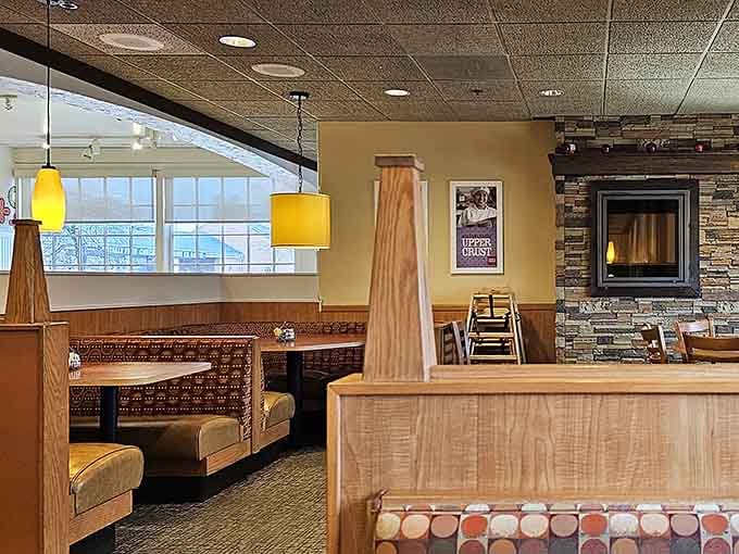 Spacious dining room with booths, tables, and even a fireplace for that extra touch of homey comfort year-round.