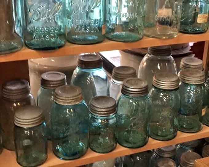 Blue Ball mason jars lined up like soldiers, ready to preserve your grandmother's secret pickle recipe.