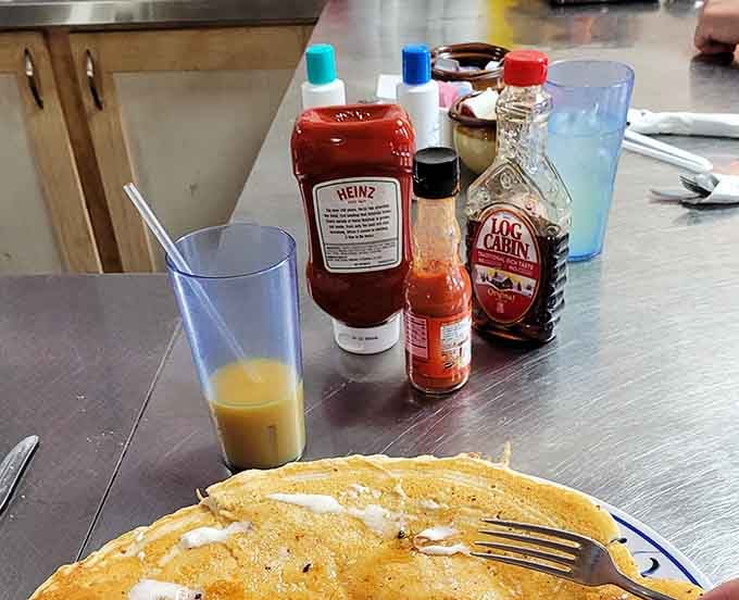 Orange juice and a pancake waiting for butter and syrup is basically the American dream on a plate.