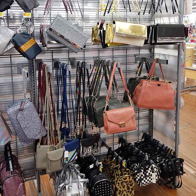Handbags hanging like fashion possibilities waiting to organize your life one compartment at a time beautifully.