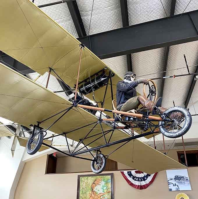 The Curtiss Model D hanging overhead reminds us that early aviators were gloriously fearless.