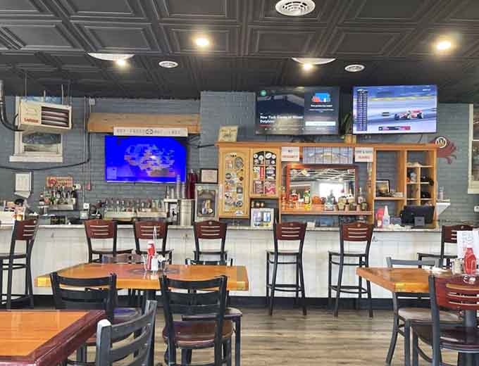 Bar seating with TVs overhead means you can catch the game while catching up on your crab consumption.
