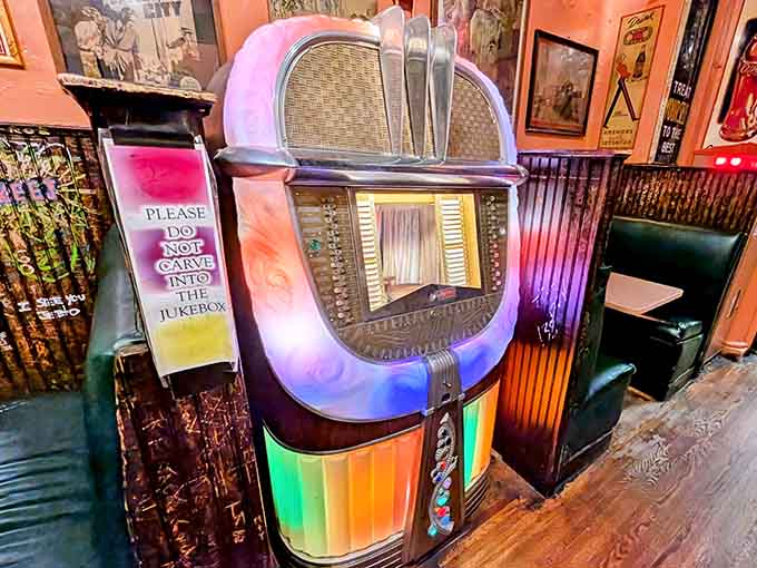 A vintage jukebox that's seen more good times than most people, still standing proud and colorful.