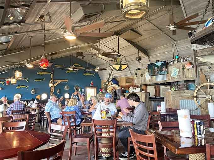 Tables full of happy diners under mounted fish and colorful lanterns prove this place has mastered the art of casual coastal gathering.