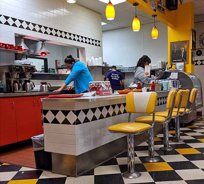 Counter seating lets you watch the kitchen magic happen while enjoying your meal like a true diner regular.