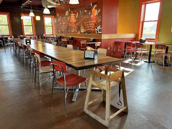 Long communal tables invite strangers to become friends over shared appreciation for exceptional sandwiches and good company.