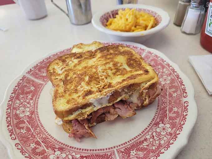 Monte Cristo griddled to golden perfection, stuffed with ham and cheese like a savory French toast dream.