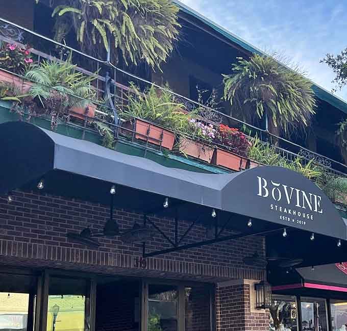 Cascading greenery on the balcony adds urban sophistication to this brick steakhouse on charming Park Avenue.
