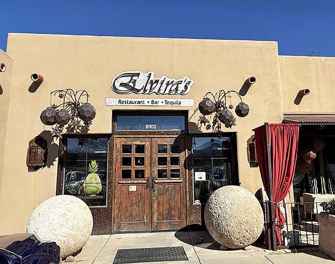 The artistic metal sculptures flanking those wooden doors announce this isn't your average taco joint, friends.