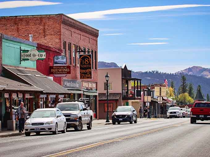 Historic brick buildings wear their age gracefully, framed by mountains that make even the tallest structure feel wonderfully humble.