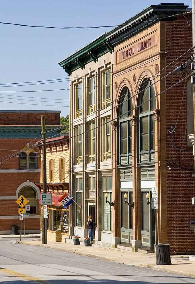 That ornate facade with "Harfield Building" carved in stone represents craftsmanship from a more patient era.