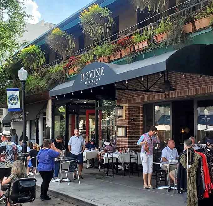 The bustling sidewalk scene and elegant awning prove this downtown gem draws crowds who appreciate quality dining.