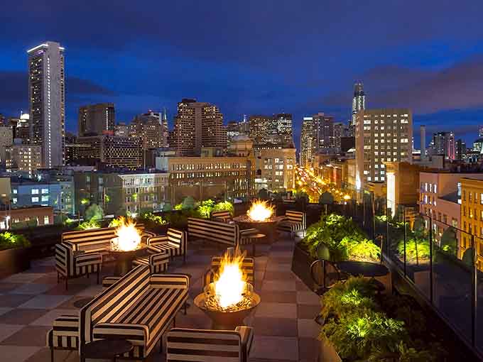 Multiple fire features mean every seat gets warmth while the skyline puts on its nightly light show.