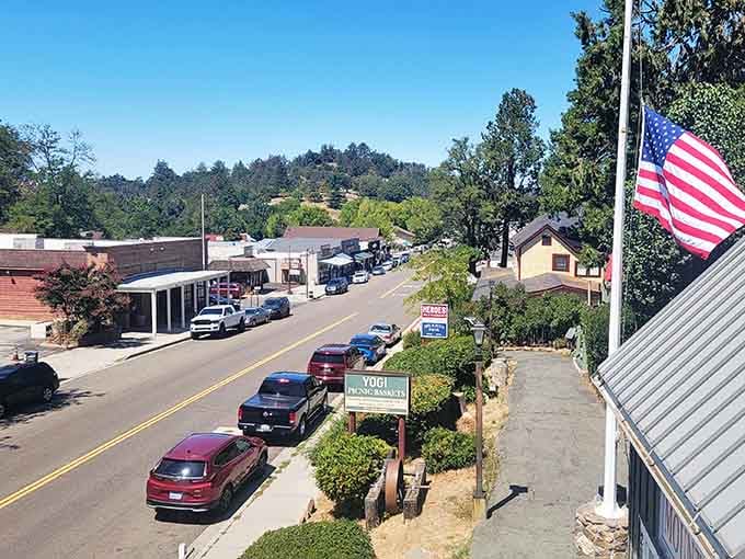 The American flag waves proudly over a main street where patriotism and neighborliness are still in style.
