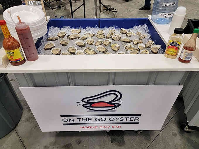 Fresh oysters on ice with hot sauce options lined up like soldiers ready for duty, now that's service.