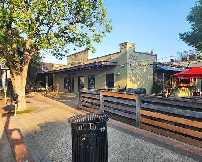 Golden hour light bathes the patio where string lights promise evening meals under the stars with exceptional smoked meats.