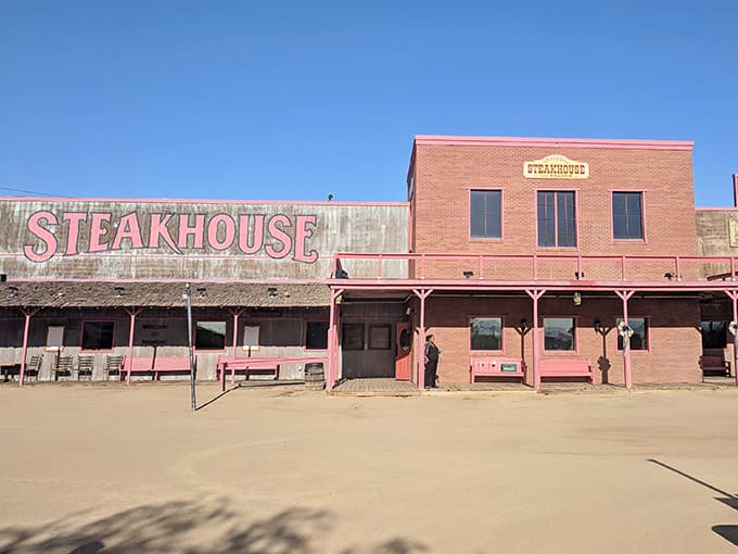Desert dust and weathered wood create an authentic frontier setting where hearty meals await hungry travelers.