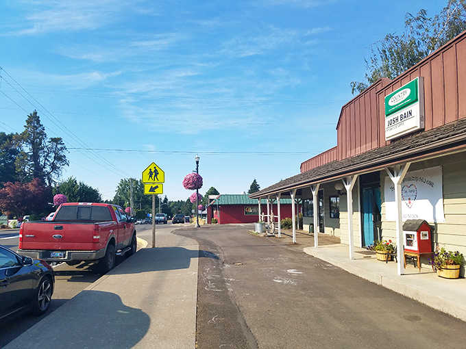Covered sidewalks provide shelter from Oregon's famous rain, keeping shoppers dry while they browse local treasures.