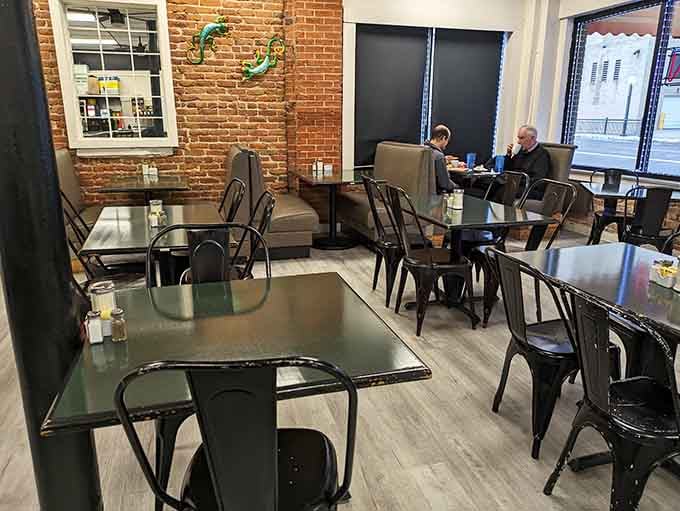 Metal chairs and simple tables prove that great food needs no fancy stage to shine brilliantly.