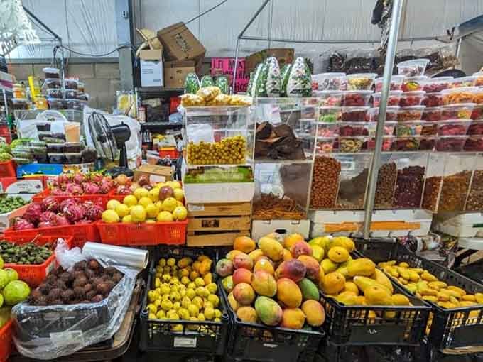 Fresh fruit displays burst with color and possibility, turning your market trip into a healthy shopping spree.