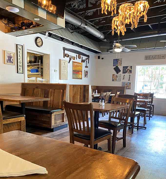 Indoor seating offers cozy comfort where mismatched chairs and warm lighting create an inviting atmosphere for lingering meals.