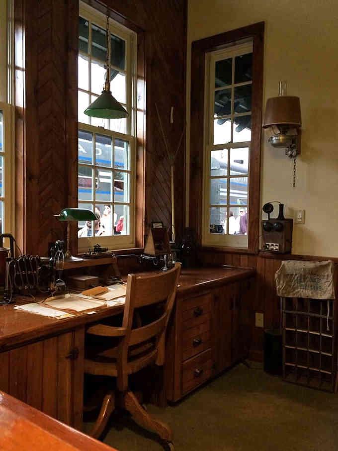 The station office preserves authentic railroad atmosphere with period details that transport you through time itself.