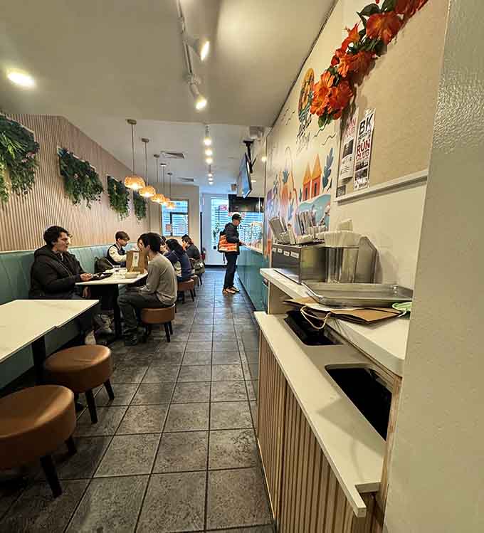 Cozy booths and round stools offer plenty of seating options for solo diners and hungry groups alike.