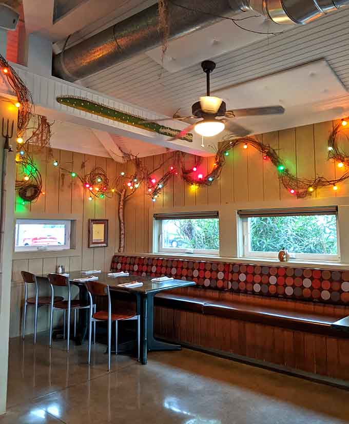 Retro booth seating under twinkling lights creates the perfect spot for lingering over good food and conversation.