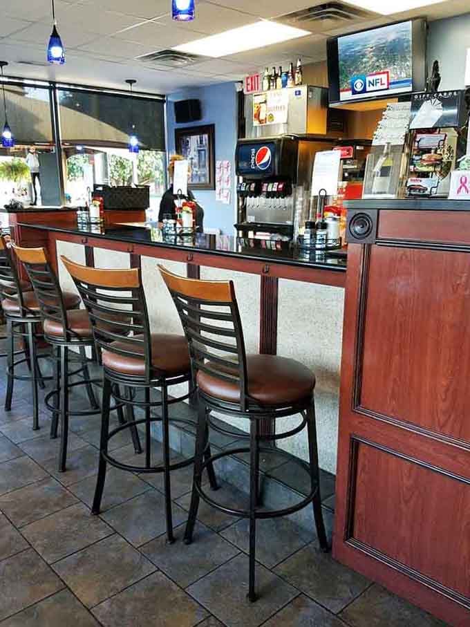 Bar seating with a view of the action and TVs overhead: the perfect spot for solo diners who like a little entertainment.