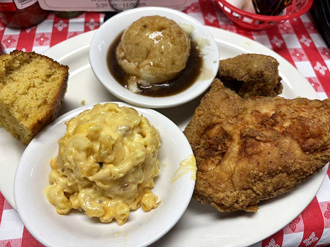 Fried chicken with mac and cheese and baked apples, Southern comfort on a single plate.