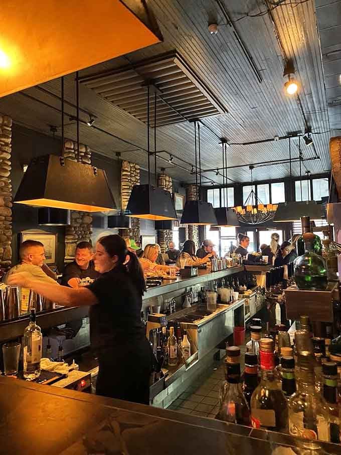 The bar area with its industrial-chic ceiling and pendant lights &ndash; where good drinks meet even better conversation.