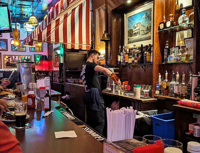Behind that striped awning bar, skilled hands are crafting drinks and experiences that keep folks coming back for years.