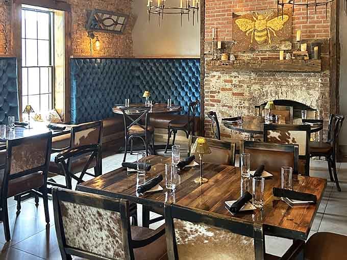 Exposed brick and tufted banquettes create an atmosphere that's equal parts sophisticated and welcoming for every diner.