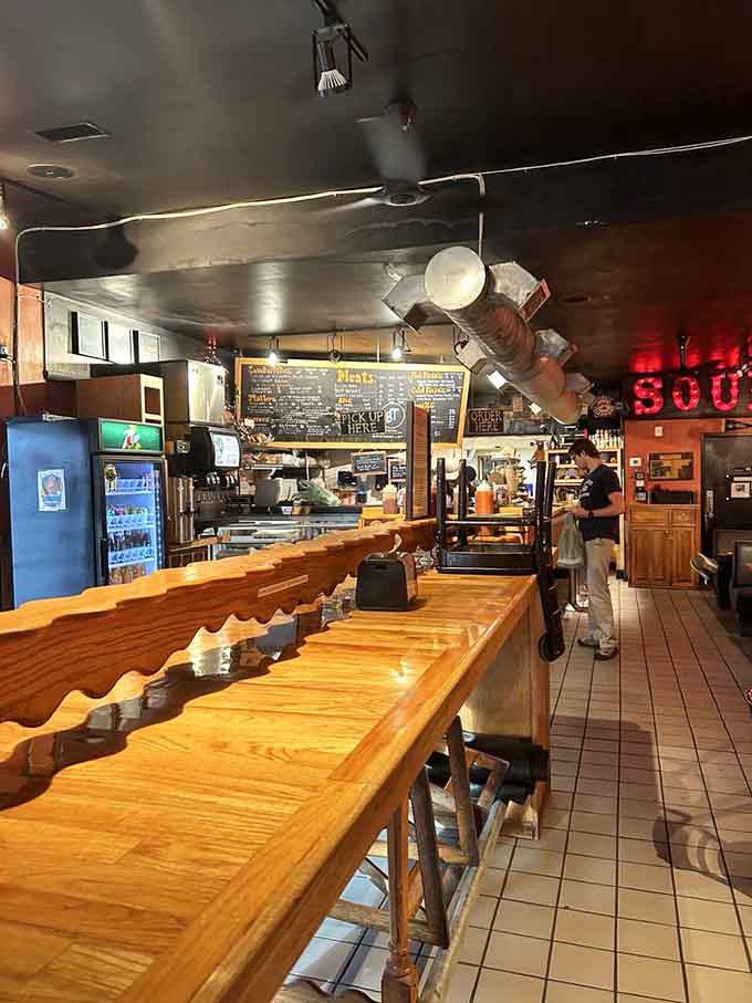 The counter where dreams are ordered and napkin strategies are desperately planned before the feast begins.