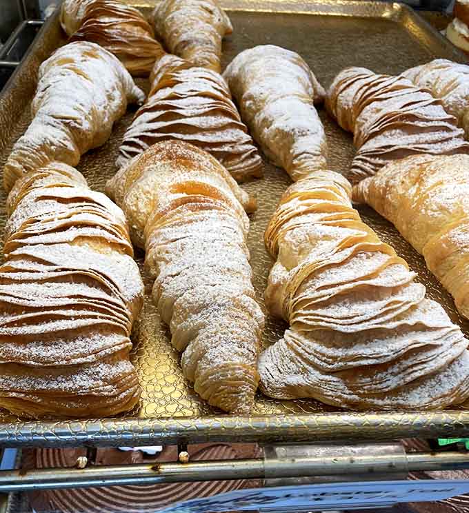 Those flaky croissants with their buttery layers and delicate drizzles look like they belong in a Parisian patisserie window display.
