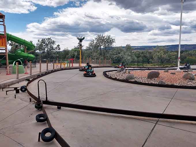 The go-kart track stretches out like a miniature speedway where dreams of NASCAR glory become wonderfully accessible reality.