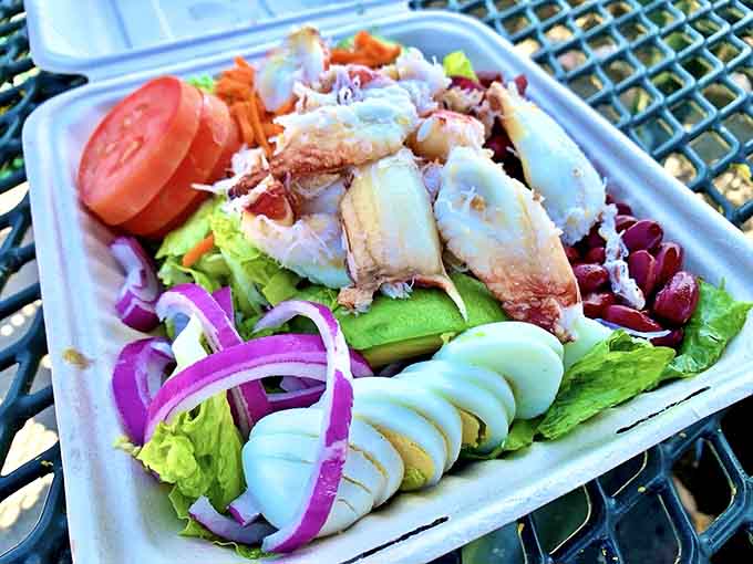 The Crab Louie Salad arrives like edible artwork, proving salads can be just as exciting as anything fried.