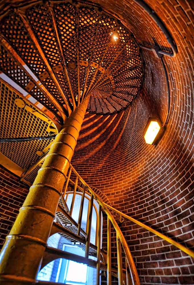 Looking up the spiral staircase is like staring into a hypnotic copper kaleidoscope that demands climbing.
