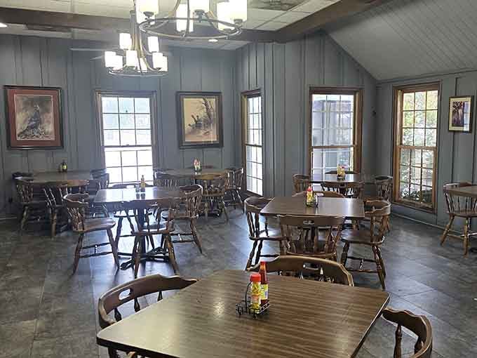 The dining room offers plenty of seating with windows that let natural light pour in while you feast happily.