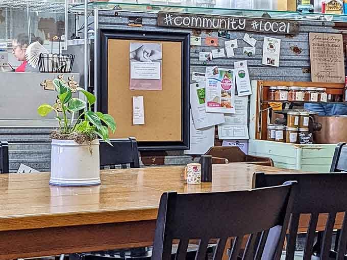 Community bulletin boards and potted plants create the kind of welcoming vibe that makes strangers feel like regulars.