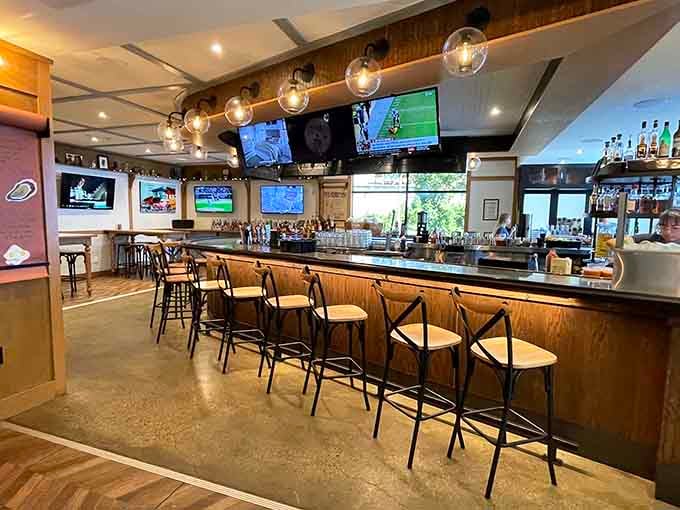 The bar stretches invitingly with screens for sports and spirits for celebrating, a multitasker's dream come true.
