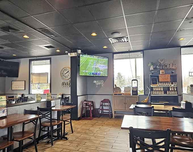 TVs for the game, tables for the feast: a casual setup that prioritizes what matters most.