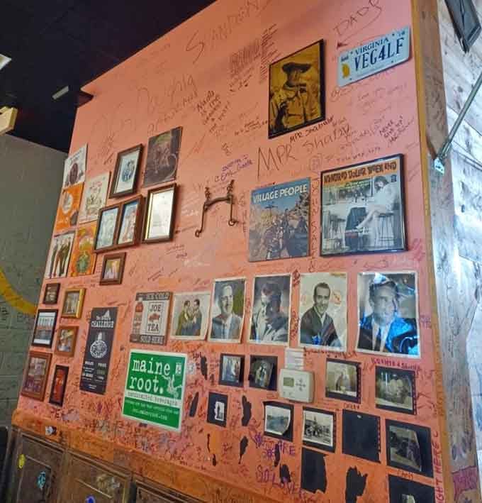 Wall decorations add character, but the real art here is watching someone successfully fold a giant slice.